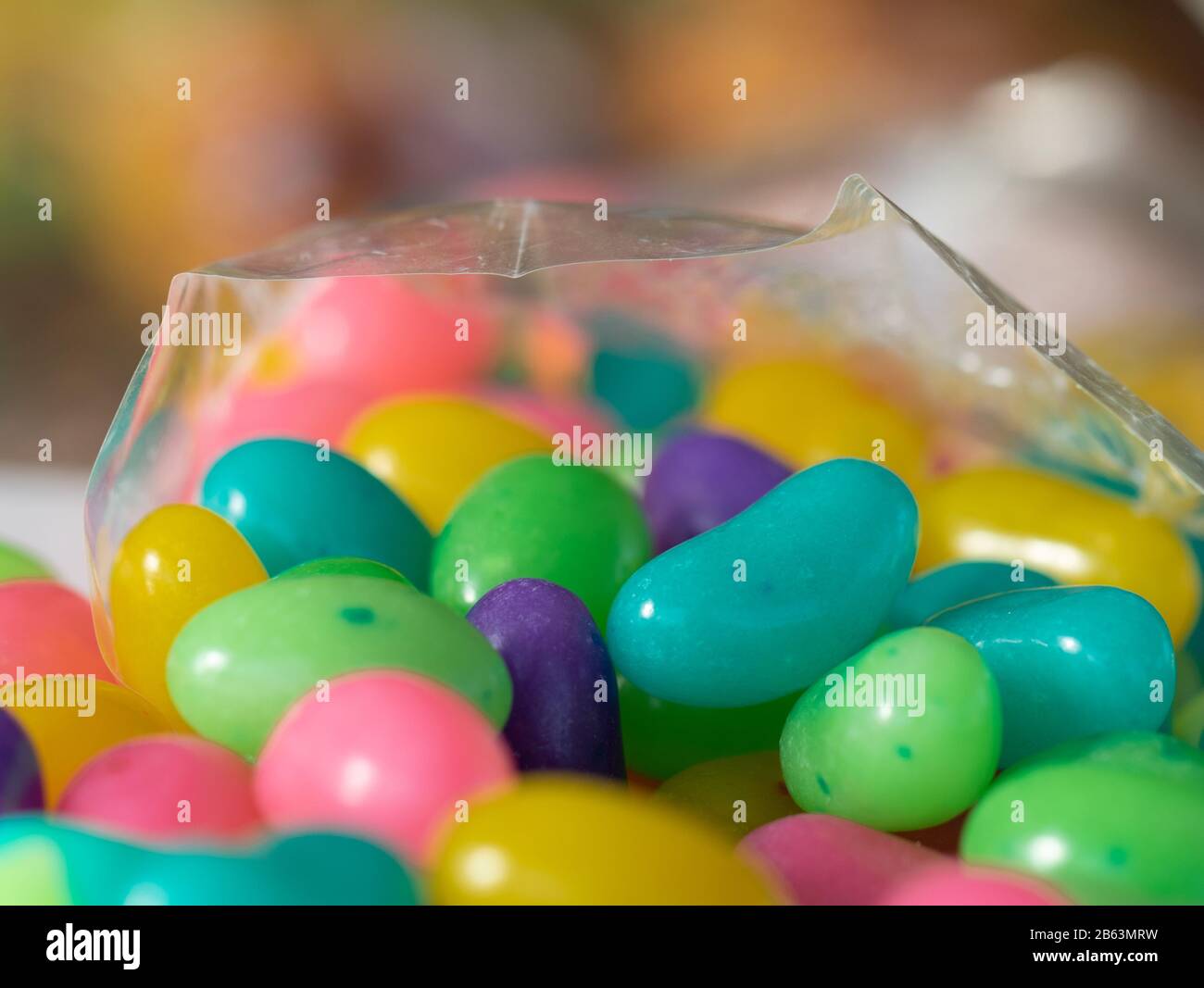 colourful Easter jelly beans spill from a cellophane bag Stock Photo ...