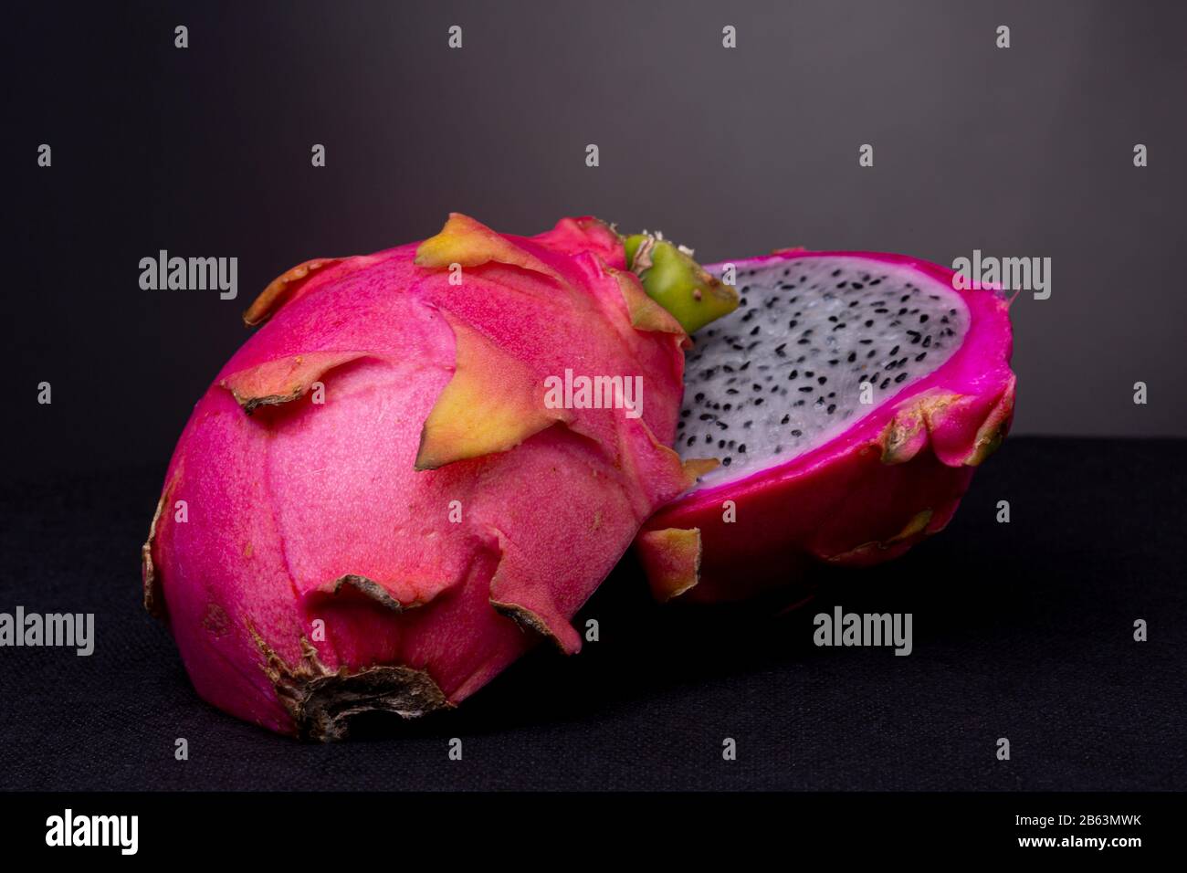 White-fleshed Pitaya or Dragon fruit with the outer scaled shell in the ...