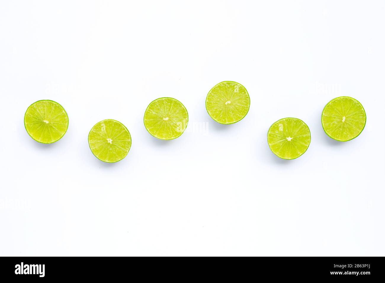 Limes isolated on white background. Copy space Stock Photo - Alamy