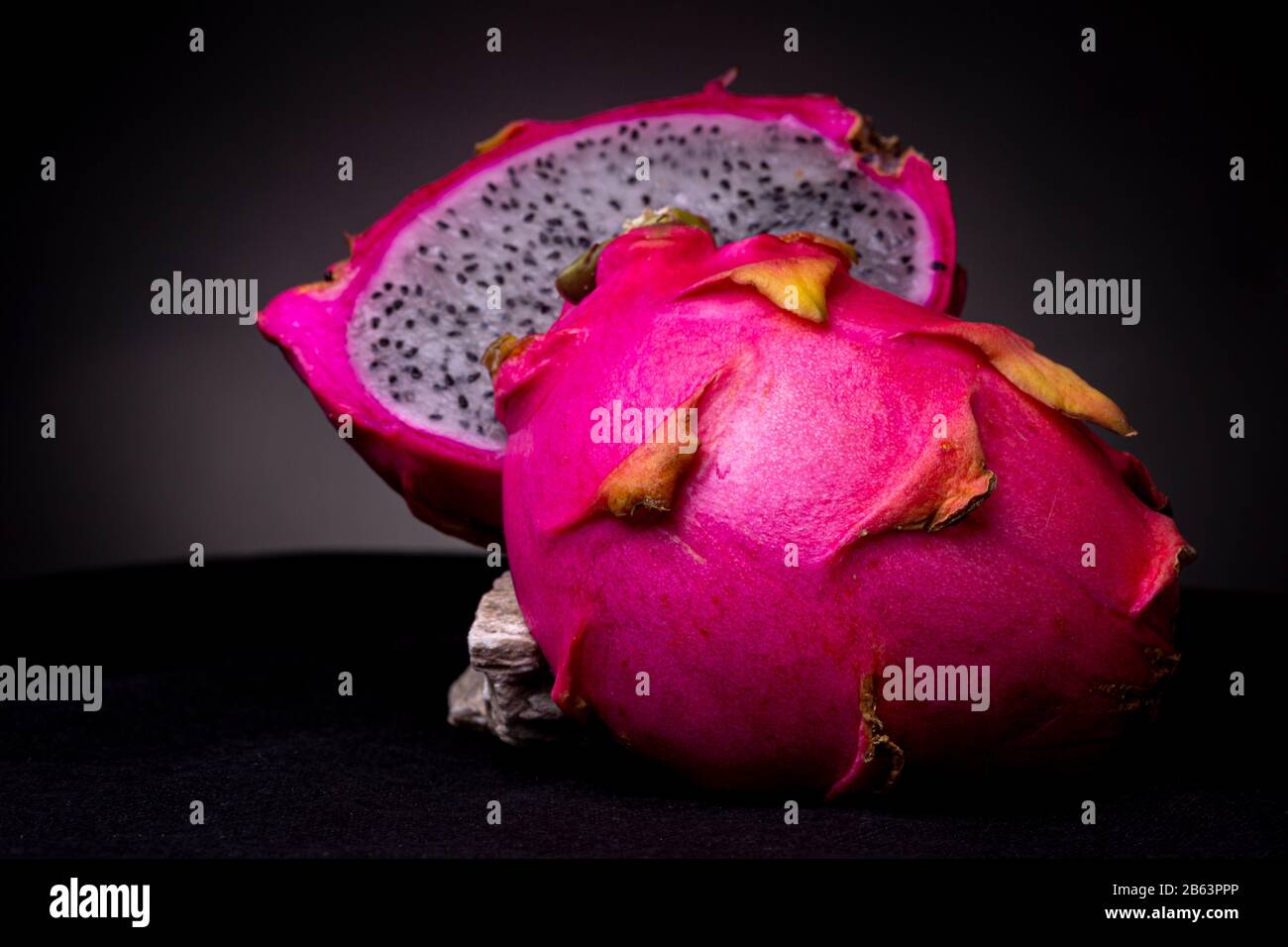 Close up of pink magenta scaled shell of a white-fleshed Pitaya or ...