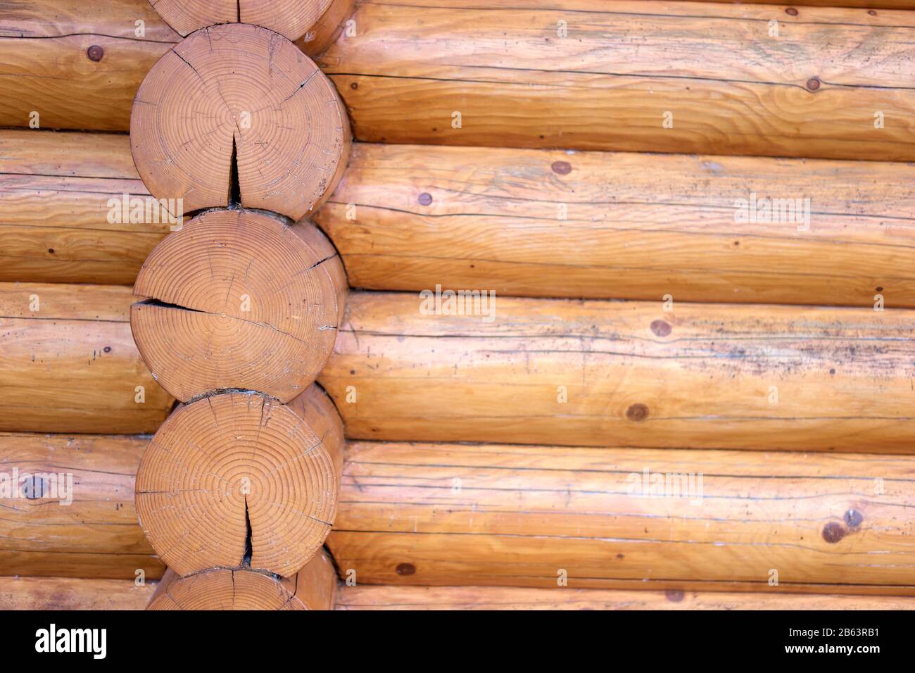 Round logs on wooden cabin house Stock Photo - Alamy