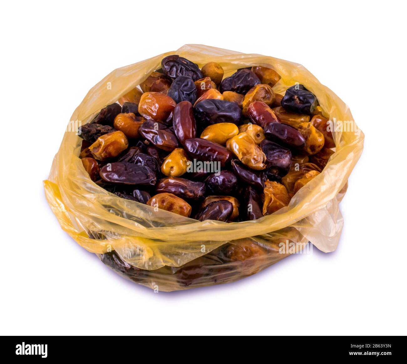 Dried dates in a shopping bag, isolated on white background. Date ...