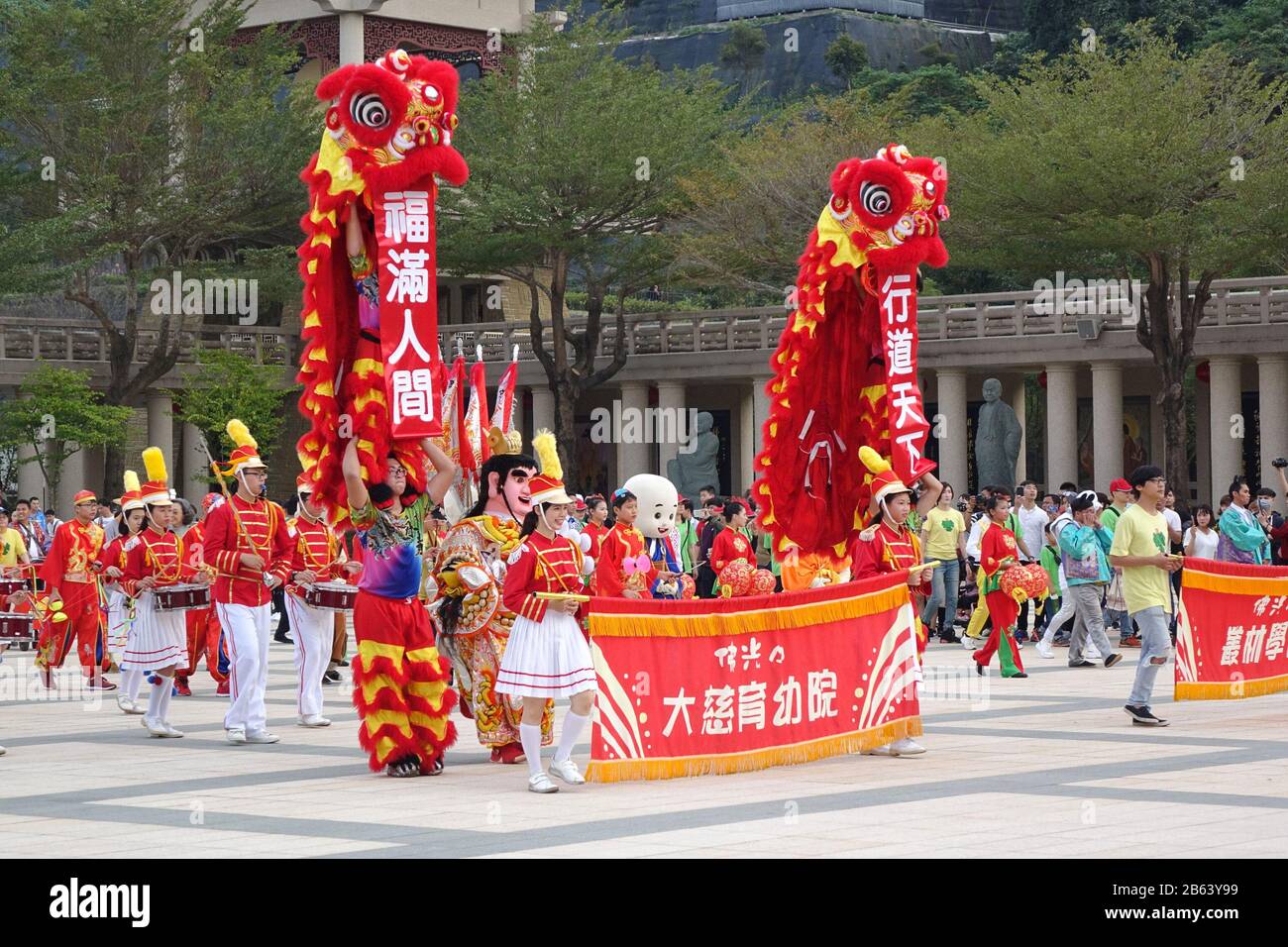 Chinese children parade with banners hi-res stock photography and ...