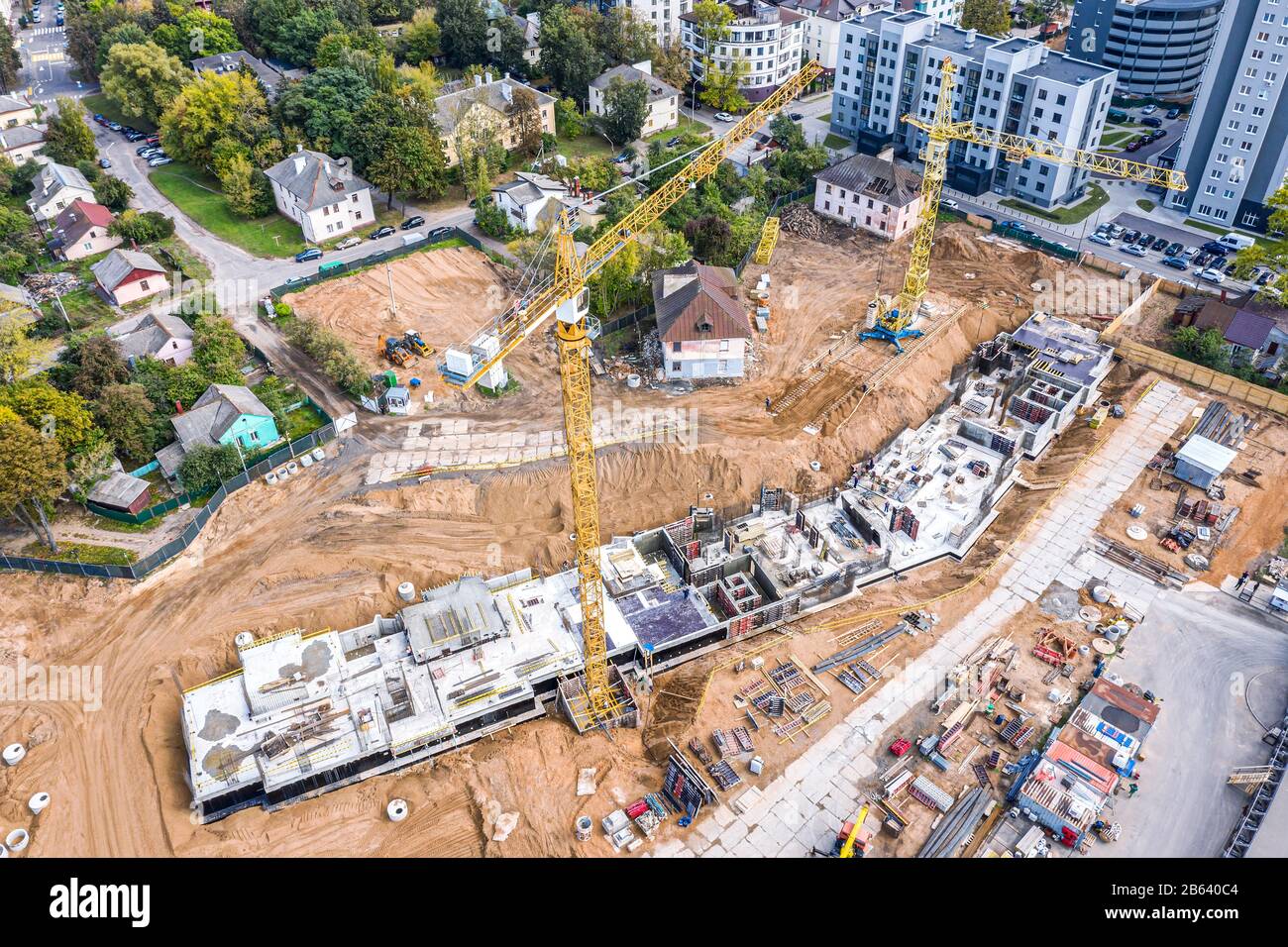 city construction area with tower cranes and building equipment. aerial ...