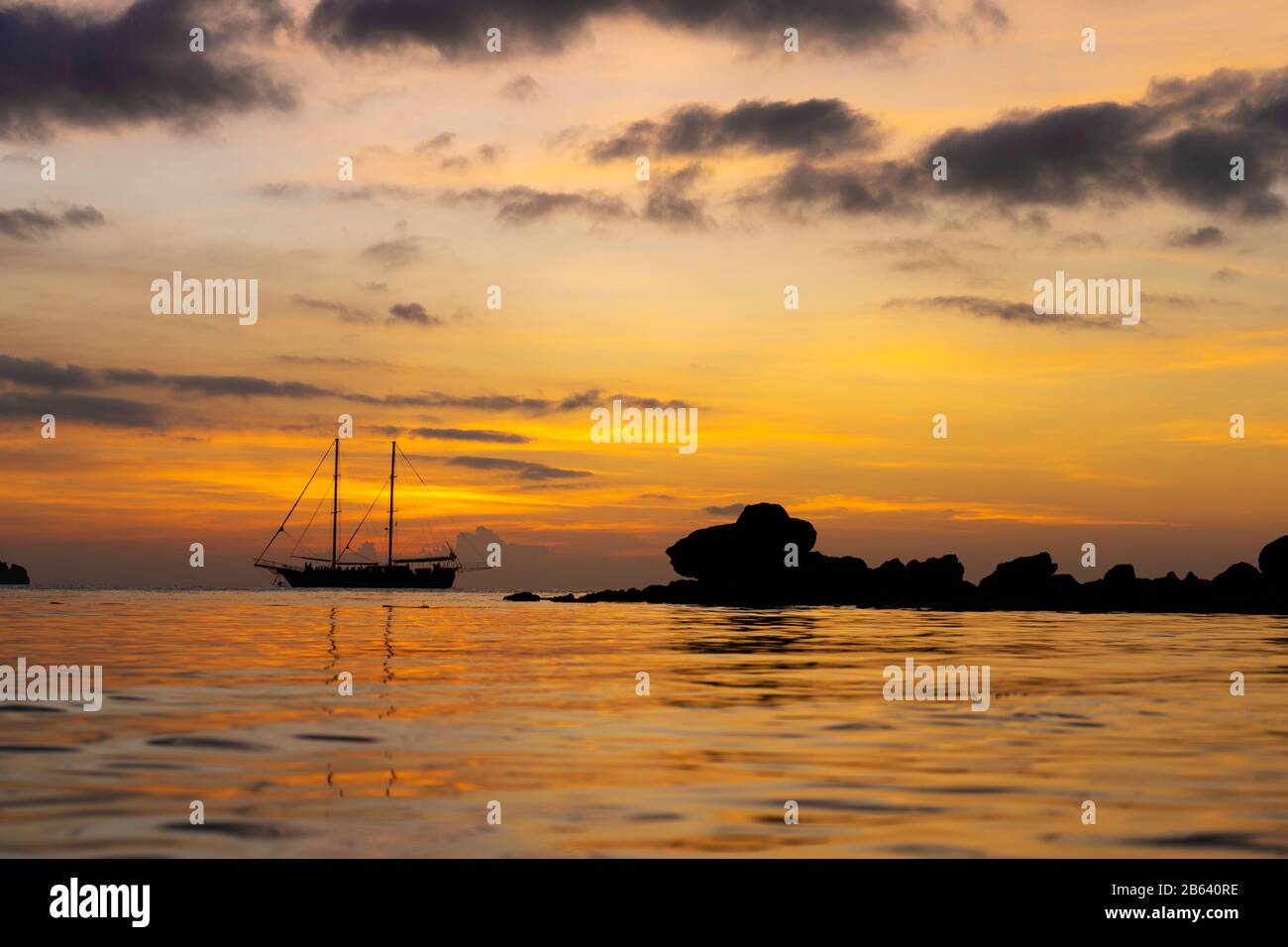 Colorful sunset on a tropical beach. Orange sunset on the ocean ...