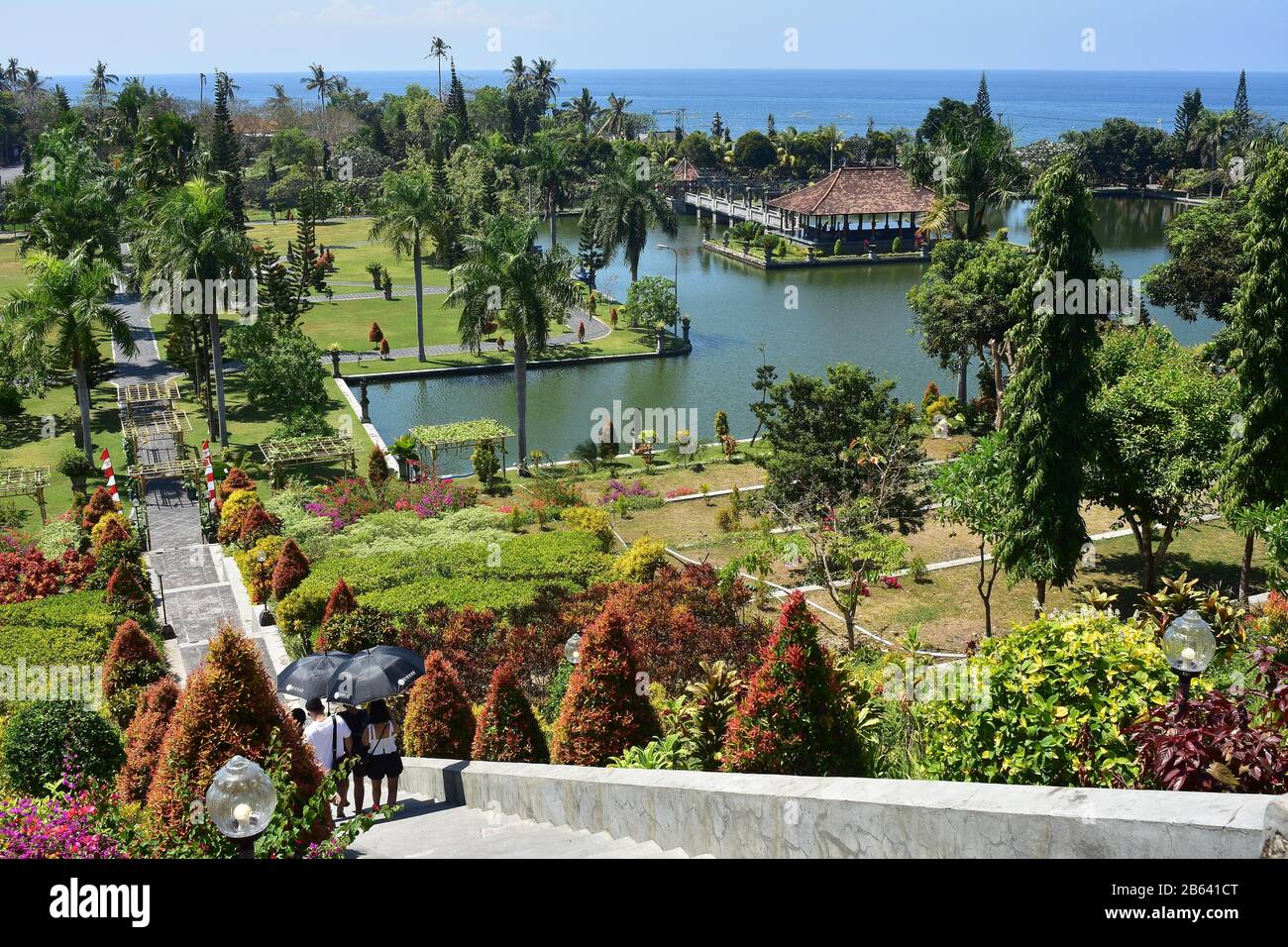 View of gardens and pond of Ujung Water Palace in Bali from height of ...