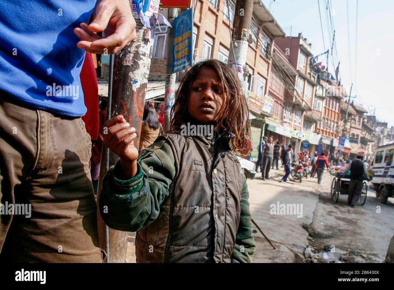 Child begging in streets hi-res stock photography and images - Alamy
