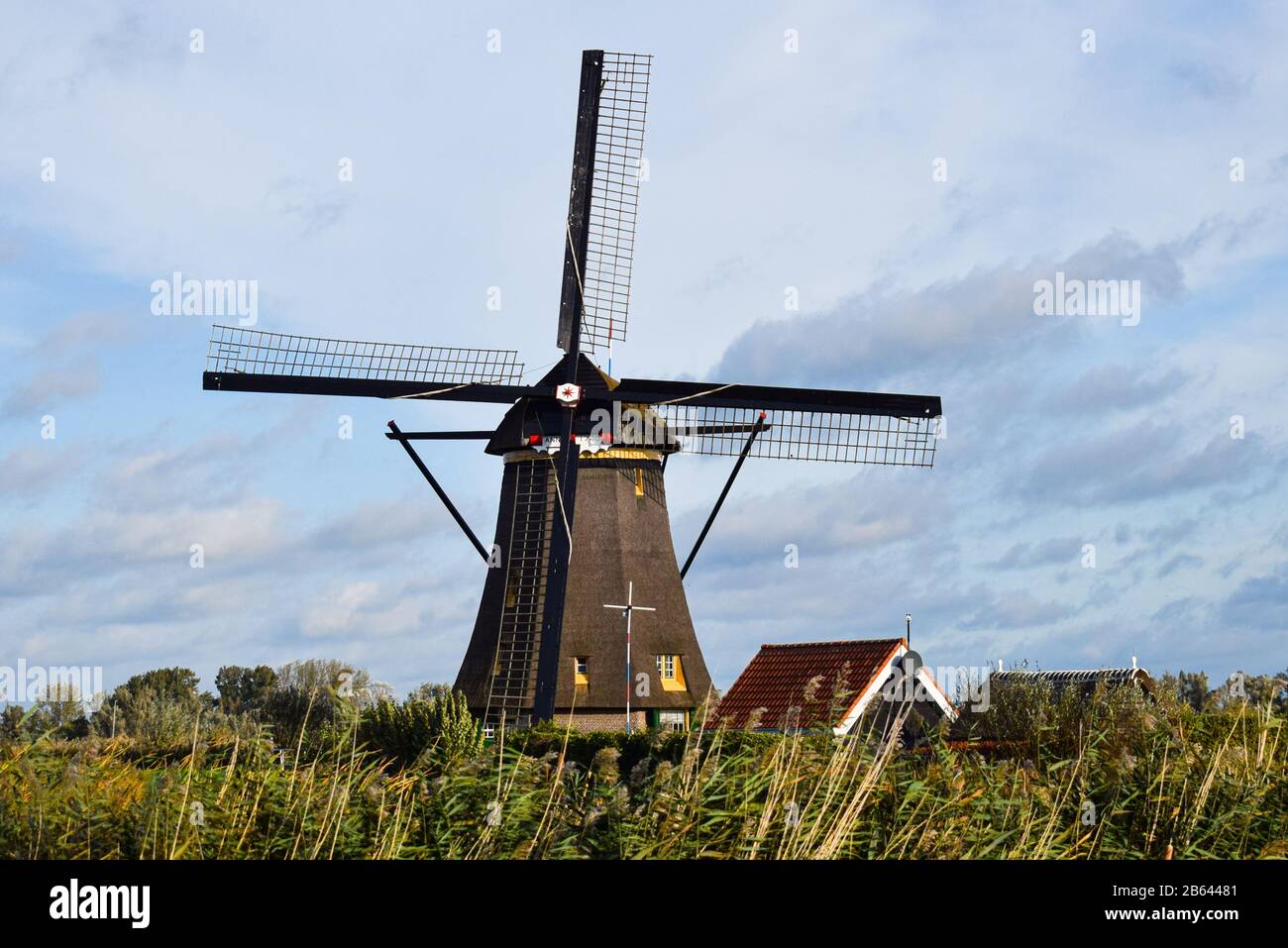 Old Dutch windmill. Blue sky background Stock Photo - Alamy