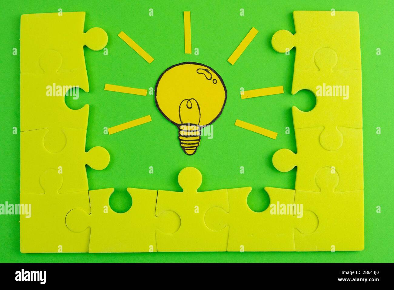 Composition with cut out paper, a picture of a light bulb located ...