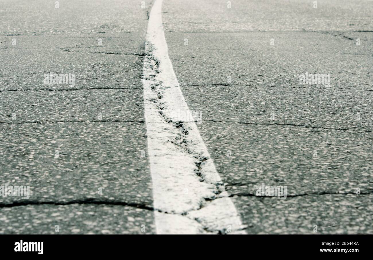 A piece of an old roadway with road markings Stock Photo - Alamy