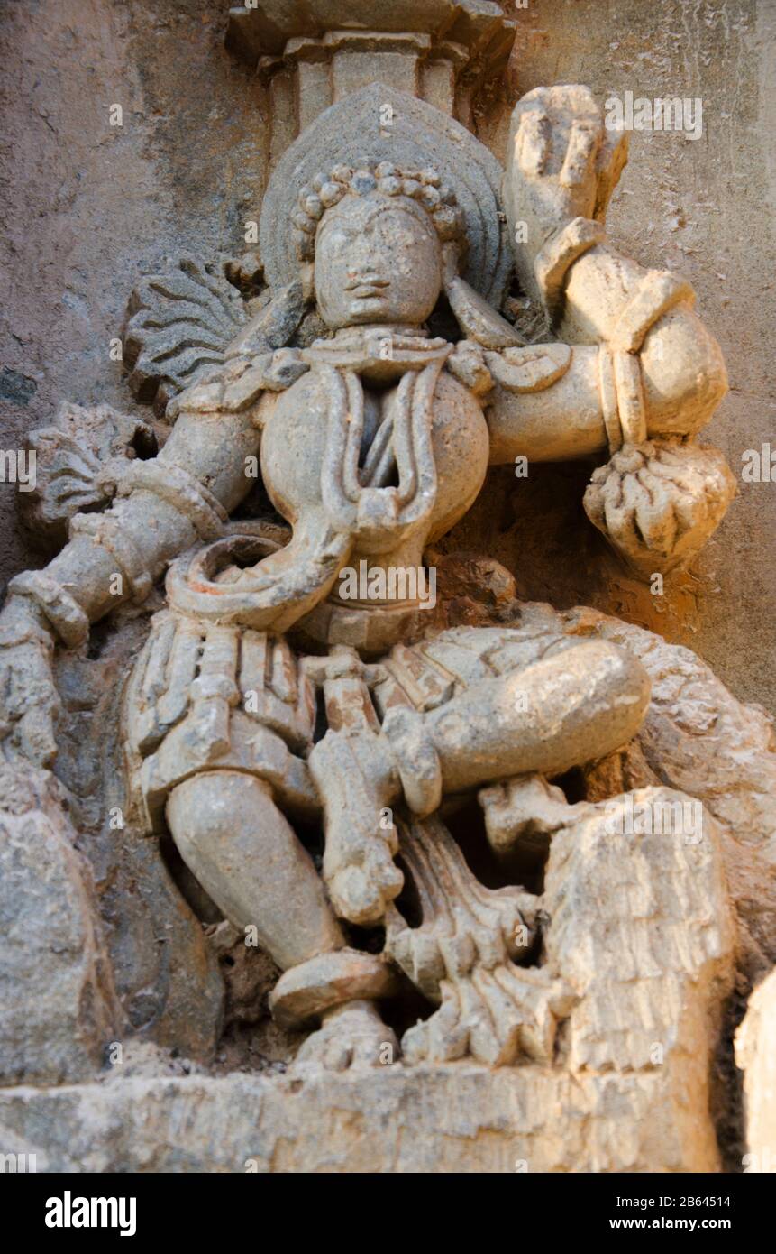 Carved idols on the outer wall of Shantinatha Basadi, near ...
