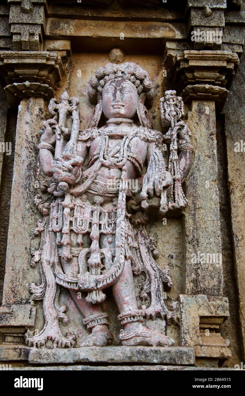Carved idols on the outer wall of Shantinatha Basadi, near ...