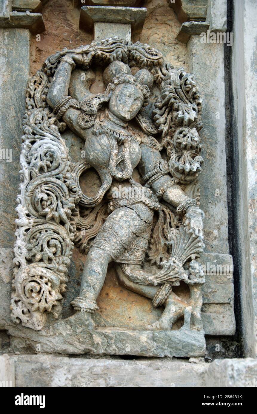 Carved idols on the outer wall of Shantinatha Basadi, near ...