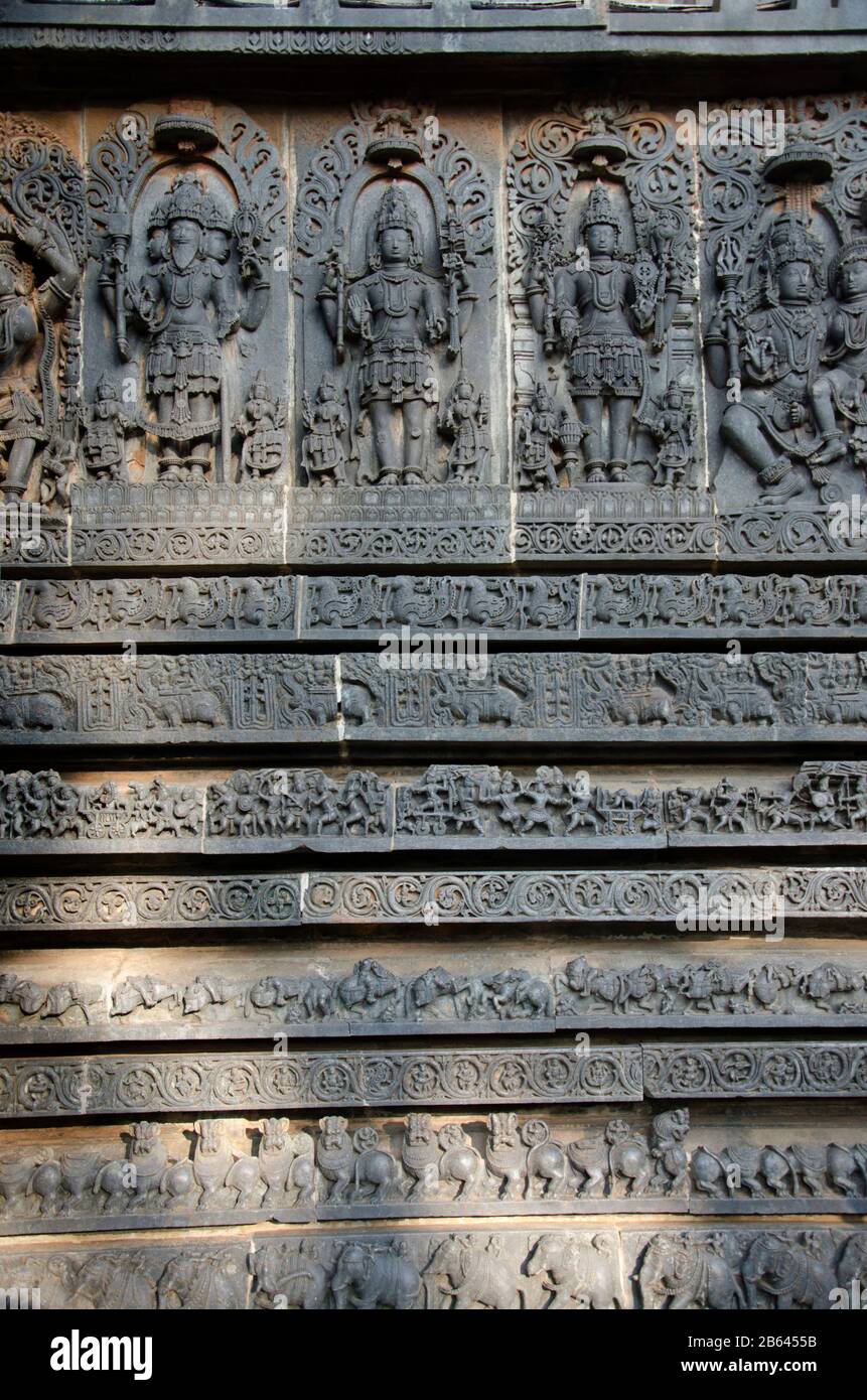 Carved idols on the outer wall of Hoysaleswara temple, is a 12th ...