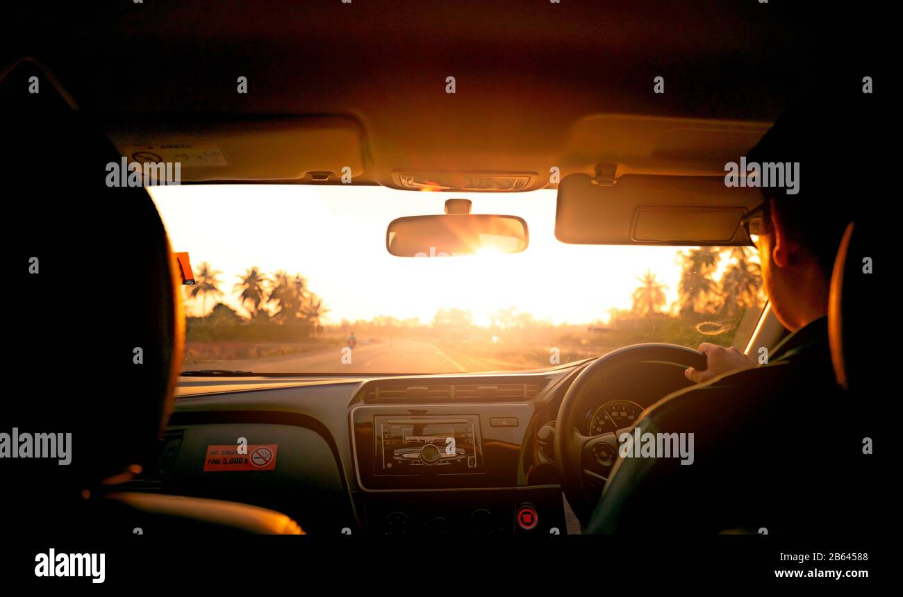 Back view of a man driving car for summer road trip travel. Car driving ...
