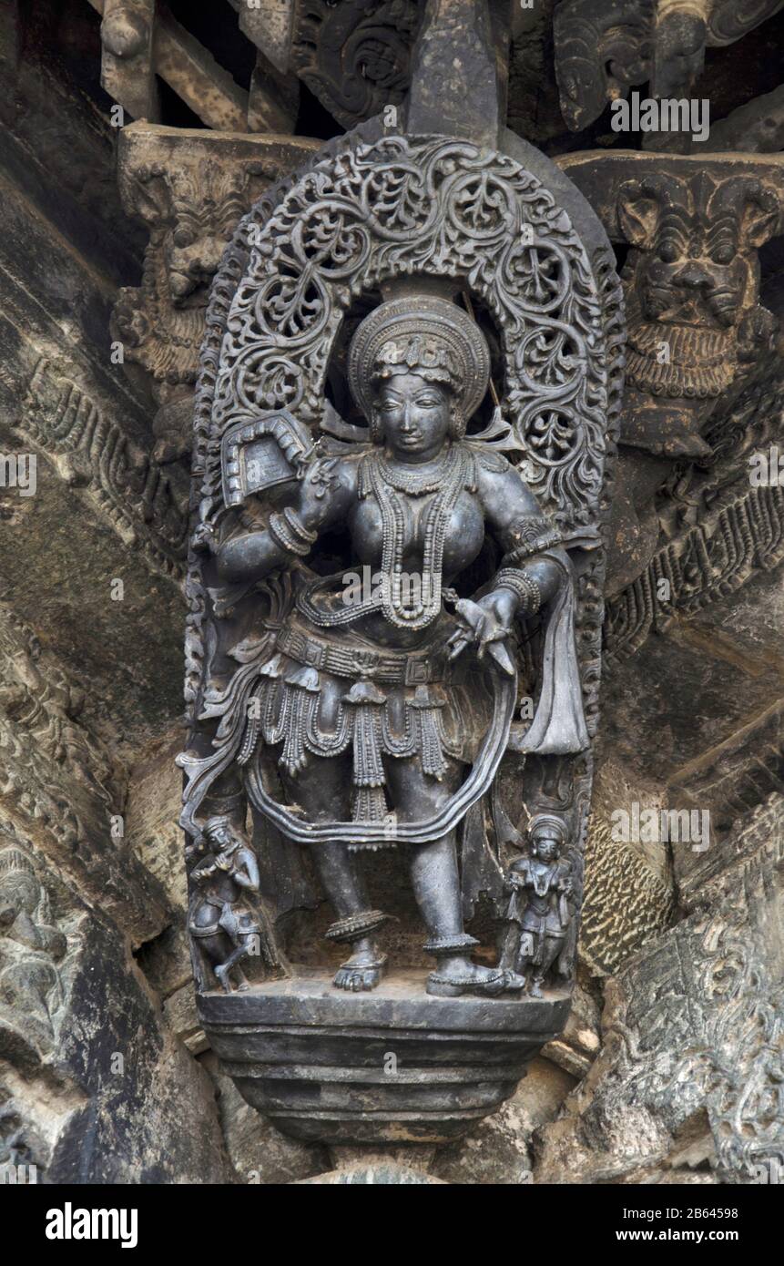 Carved sculptures on the outer wall of the Chennakeshava Temple complex ...
