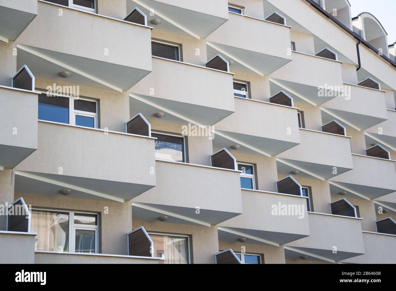View of hotel, urban building block with apartments, window pattern ...