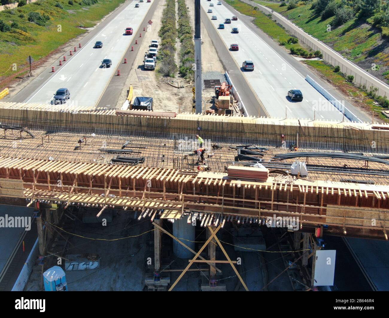 Aerial view of bridge construction crossing the highway, California ...