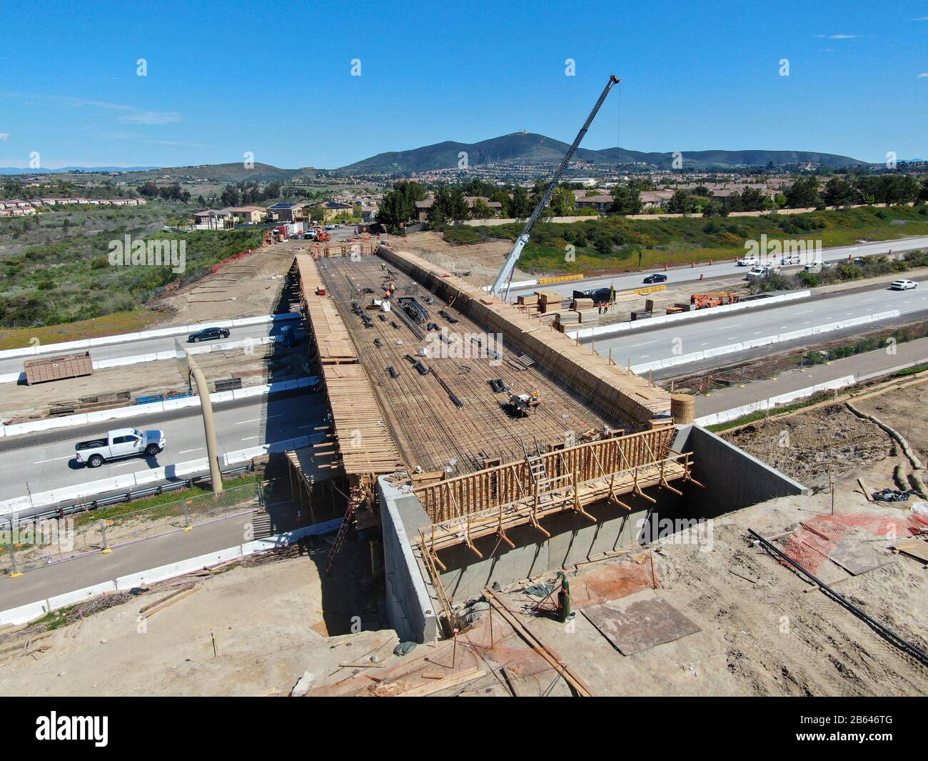 Aerial view of bridge construction crossing the highway, California ...