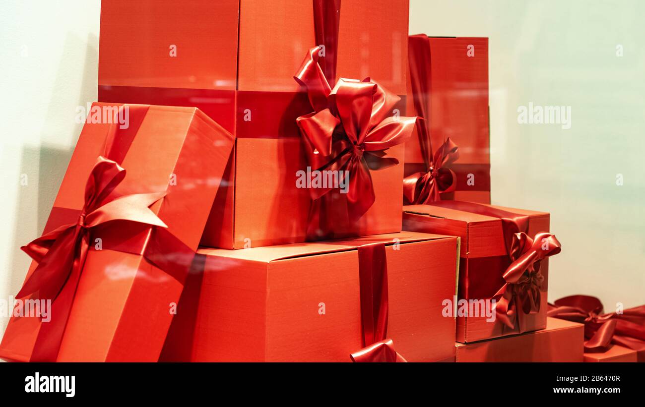 Pile of red gift boxes close up Stock Photo - Alamy