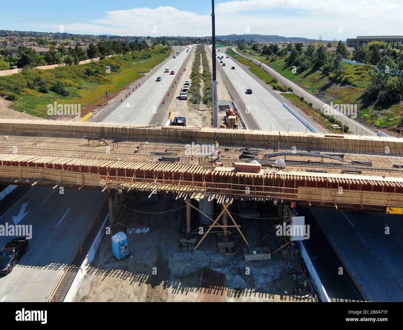 Aerial view of bridge construction crossing the highway, California ...