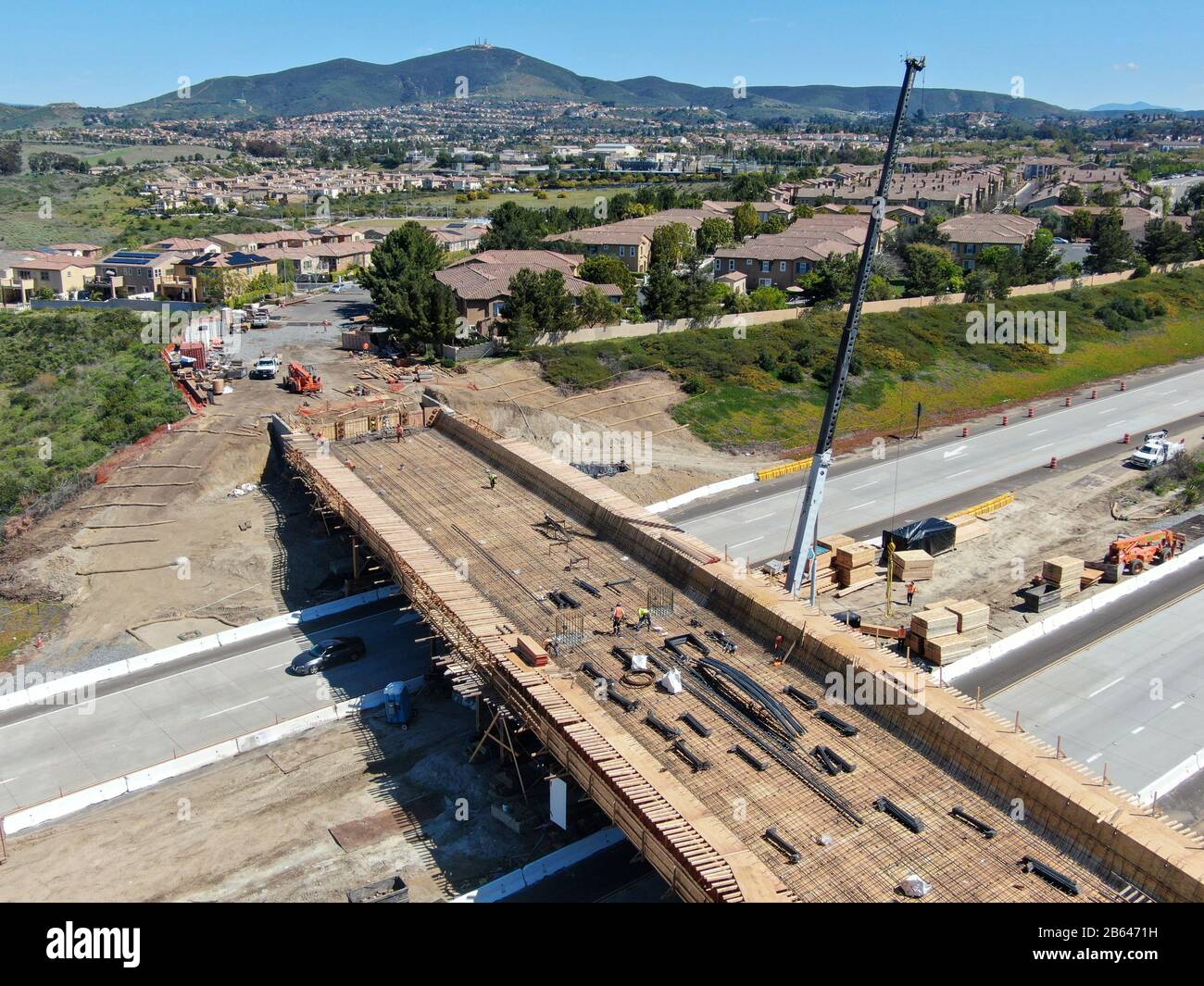 Aerial view of bridge construction crossing the highway, California ...
