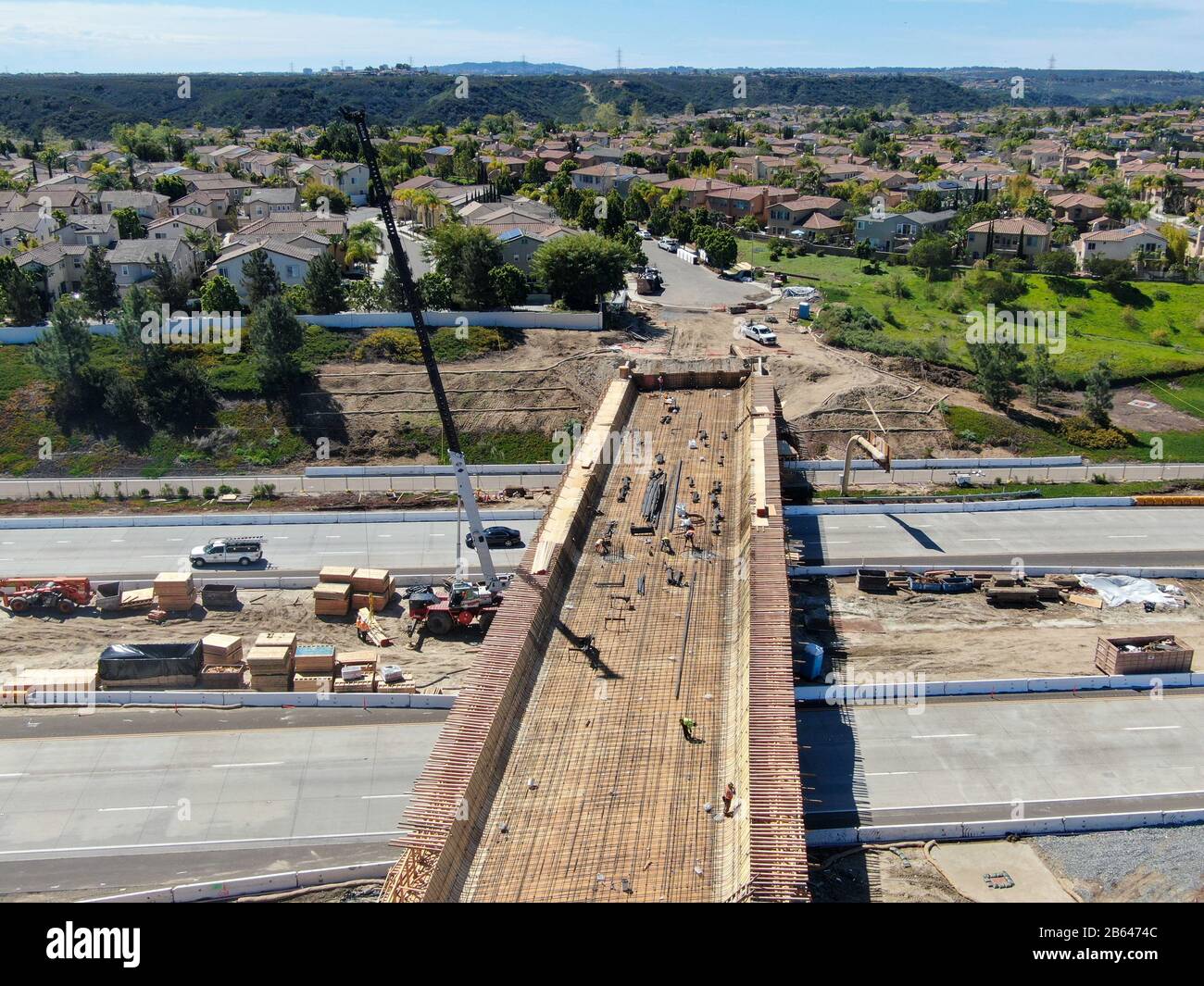 Aerial view of bridge construction crossing the highway, California ...
