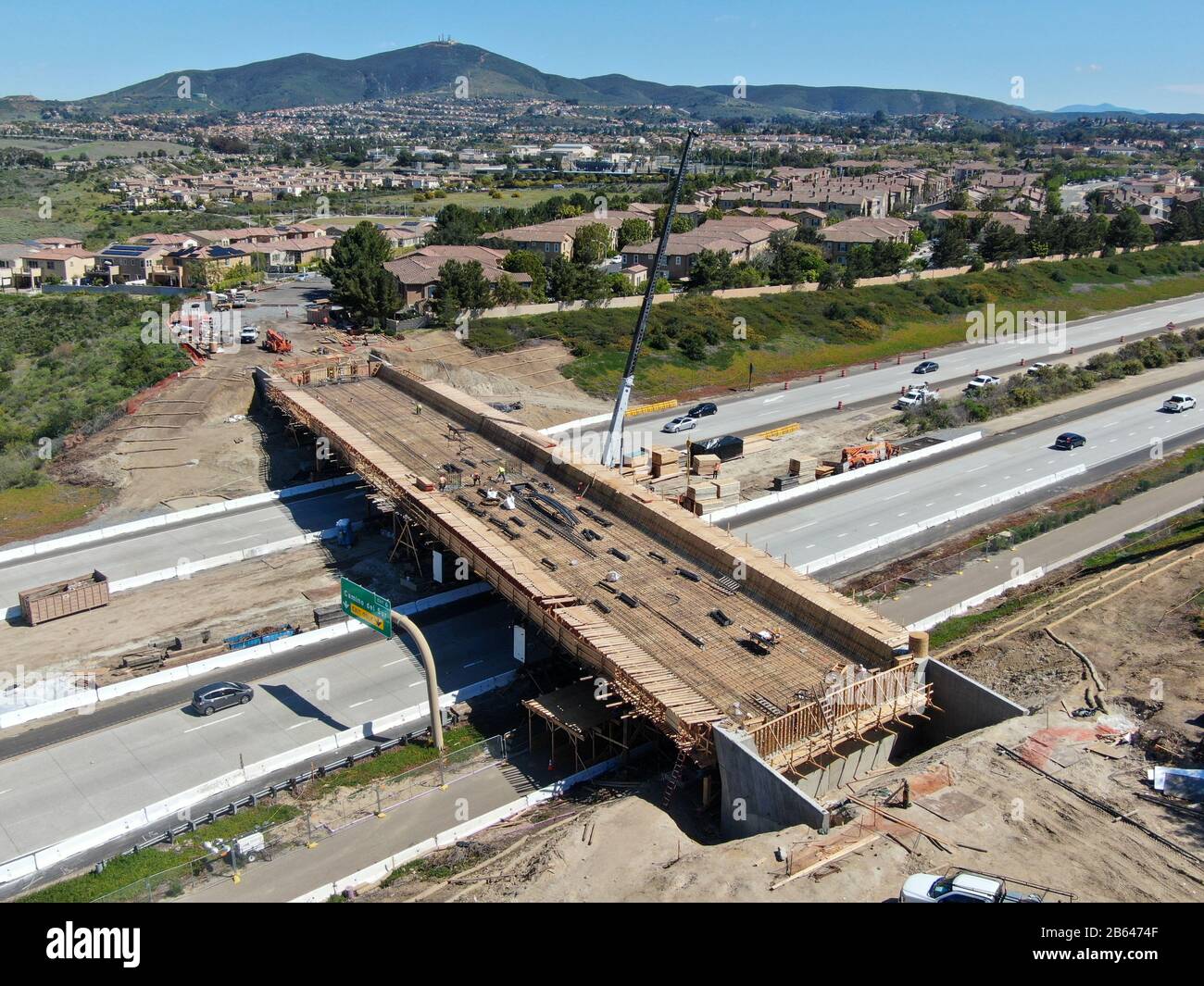 Aerial view of bridge construction crossing the highway, California ...