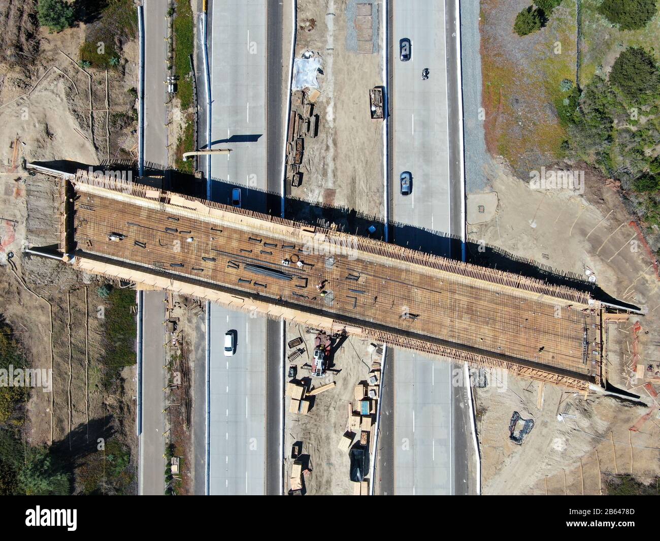 Aerial view of bridge construction crossing the highway, California ...