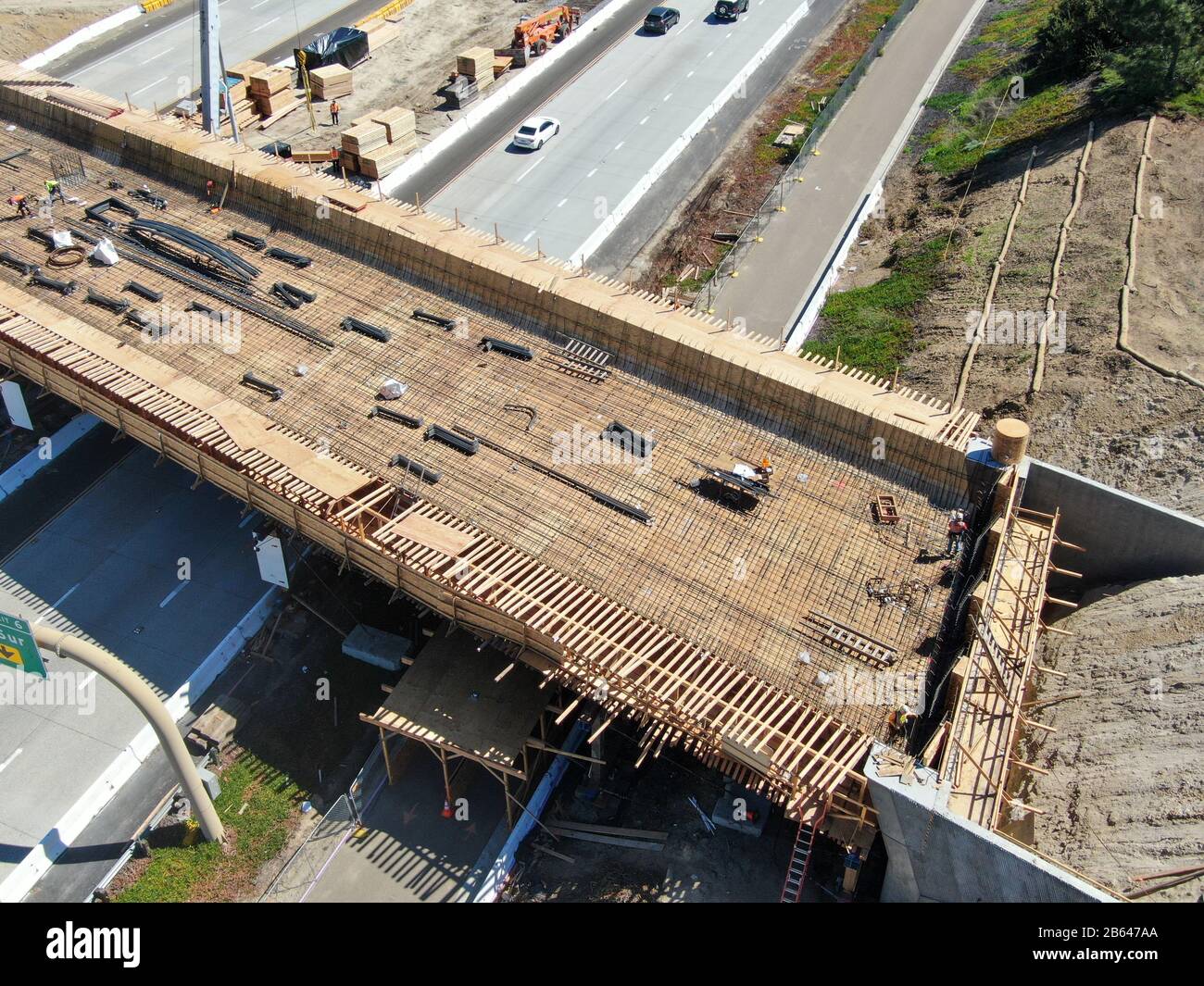 Aerial view of bridge construction crossing the highway, California ...