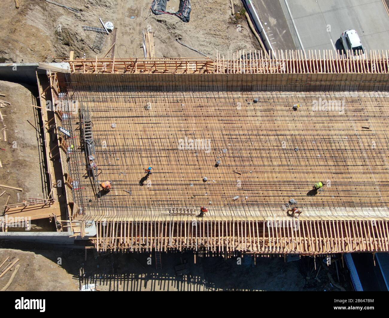 Aerial view of bridge construction crossing the highway, California ...