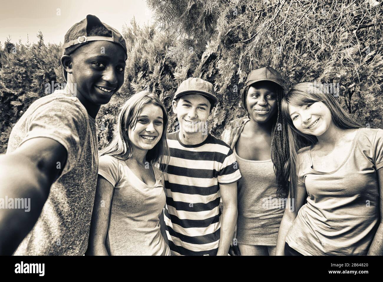 Multi ethnic teenagers smiling outdoor making selfie Stock Photo - Alamy Multi ethnic teenagers smiling outdoor making selfie Stock Photo - Alamy