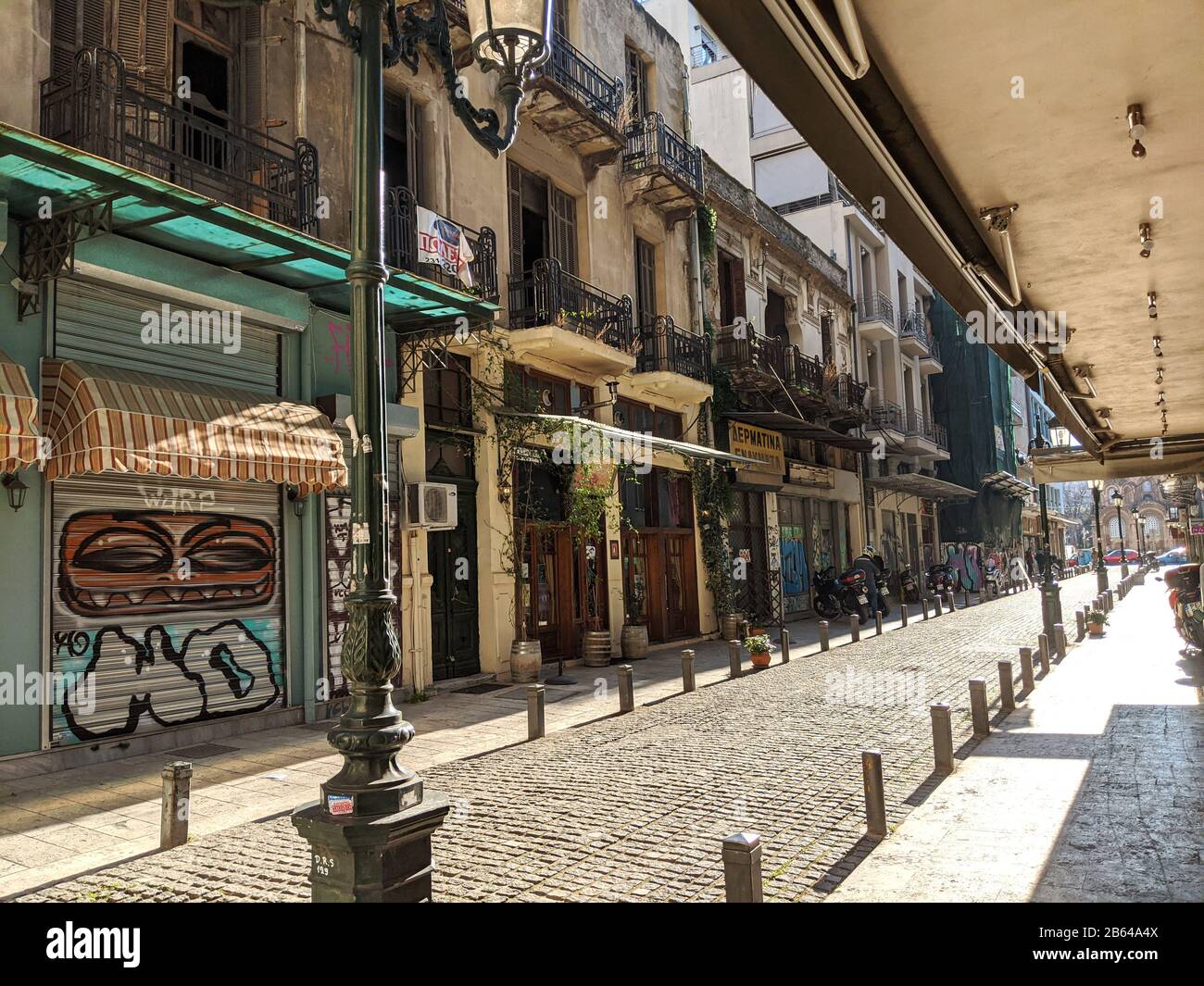 Urban building facades along narrow street in Thessaloniki downtown ...