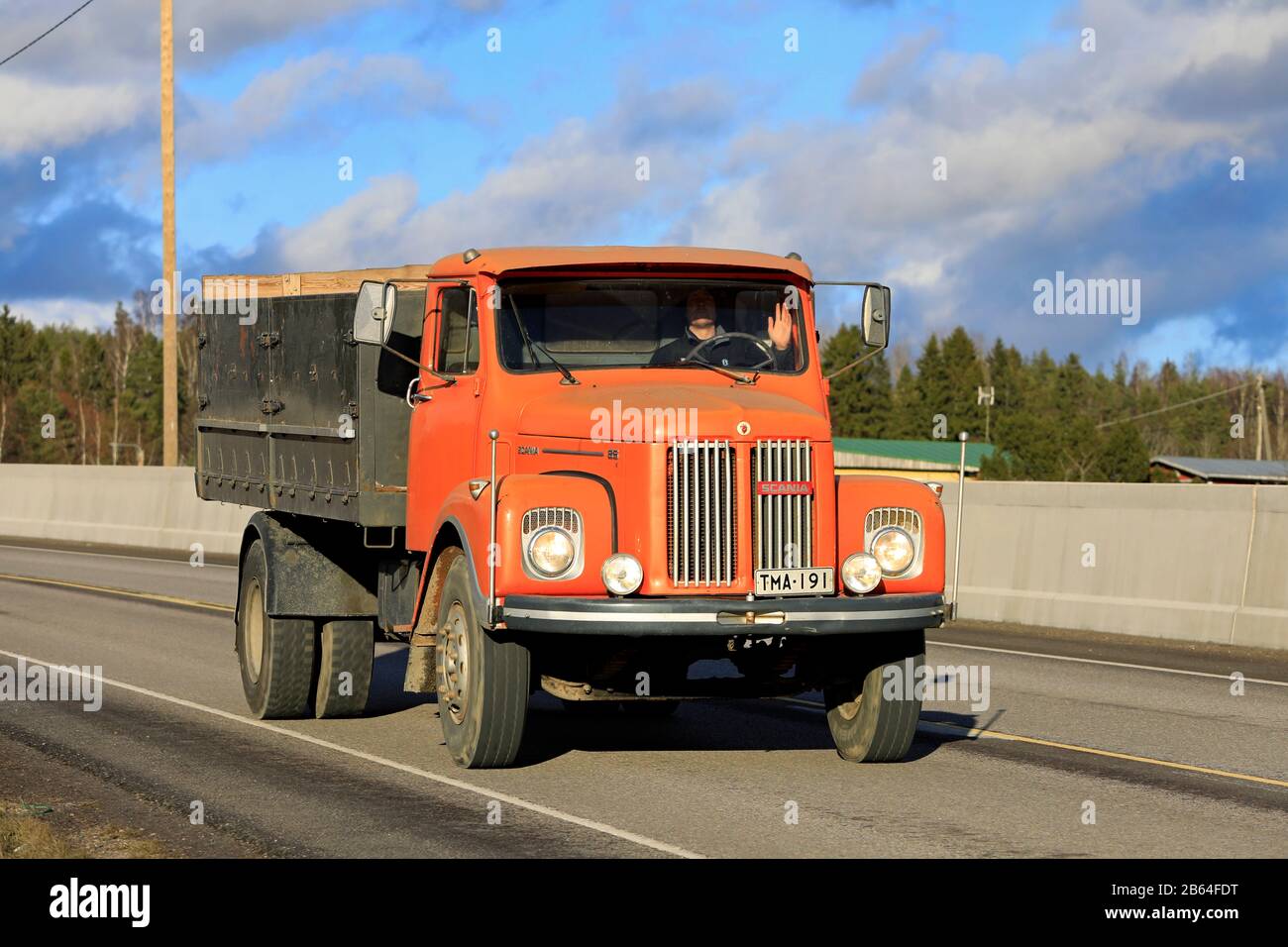Classic orange Scania L85 truck on the road in South of Finland on a ...