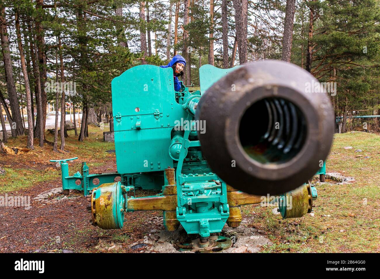the woman aiming a machine gun cannon, front view Stock Photo - Alamy