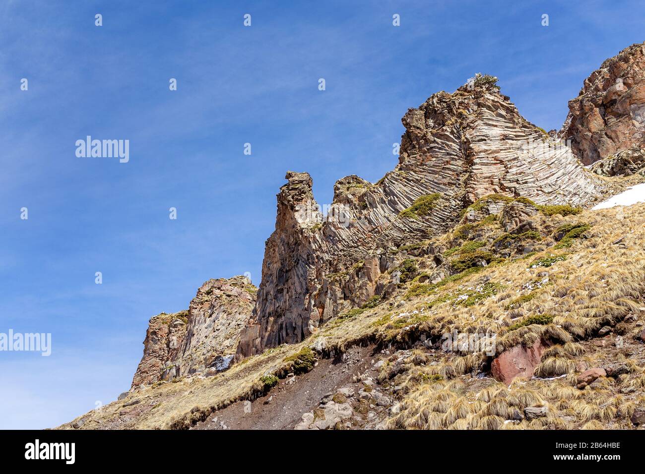 unusual geological rock or cliff in the mountains with basalt collumns ...
