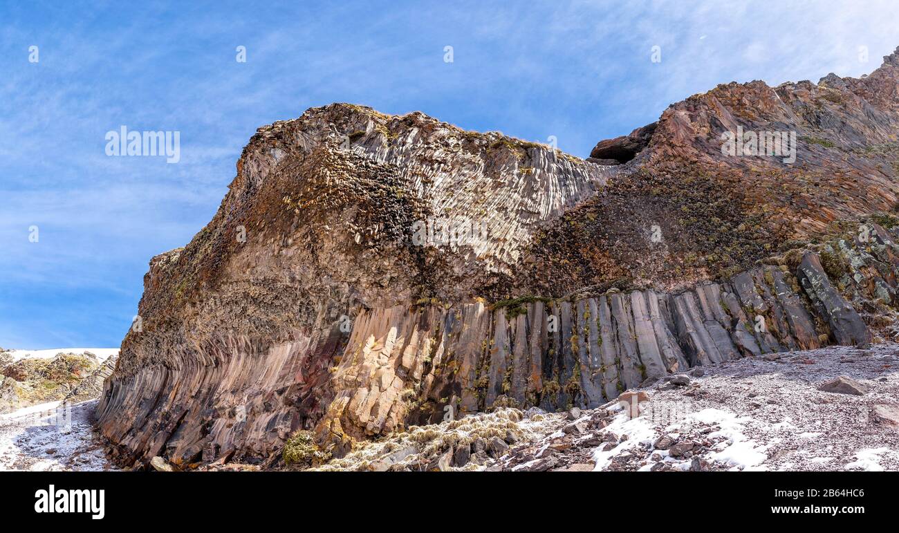 unusual geological rock or cliff in the mountains with basalt collumns ...