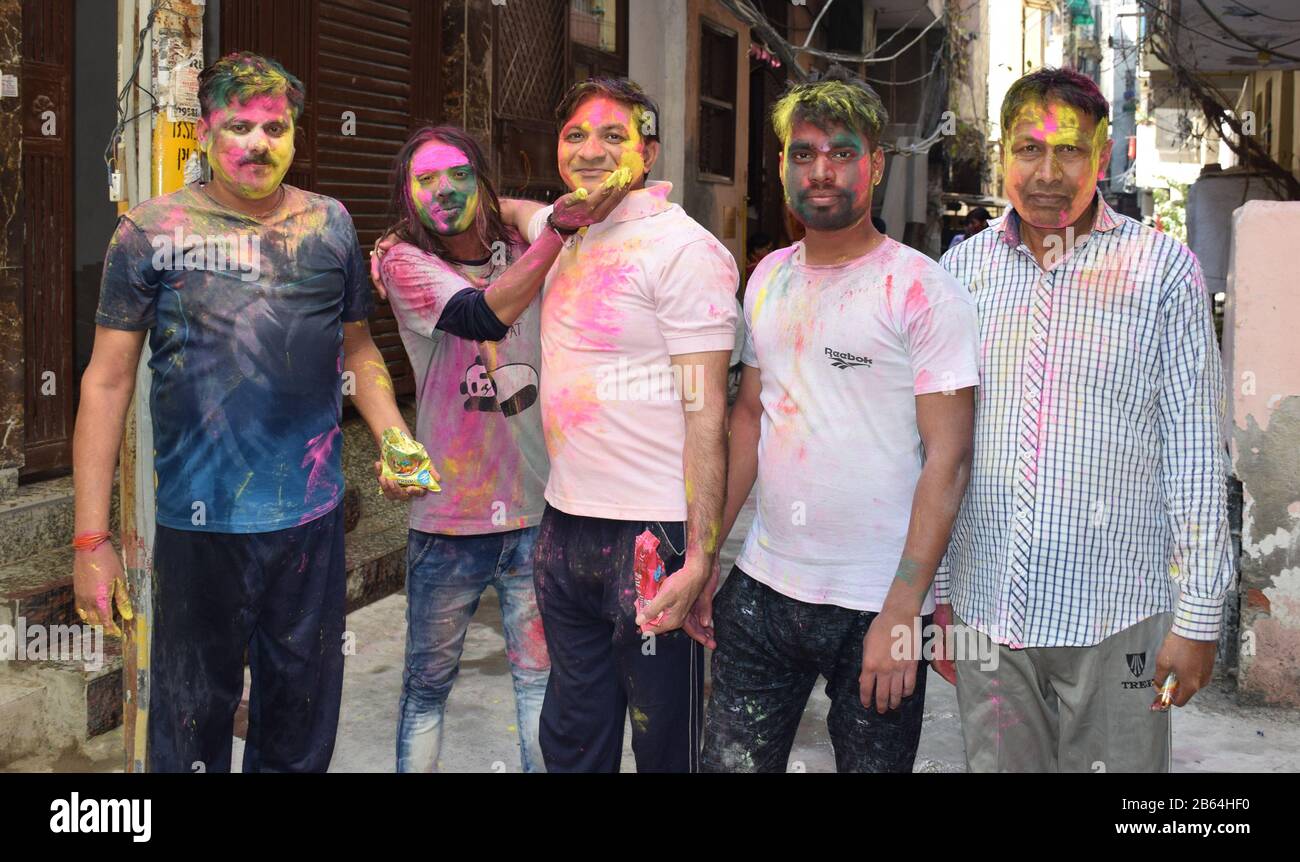 People playing traditional holi with each other also called as Dol ...