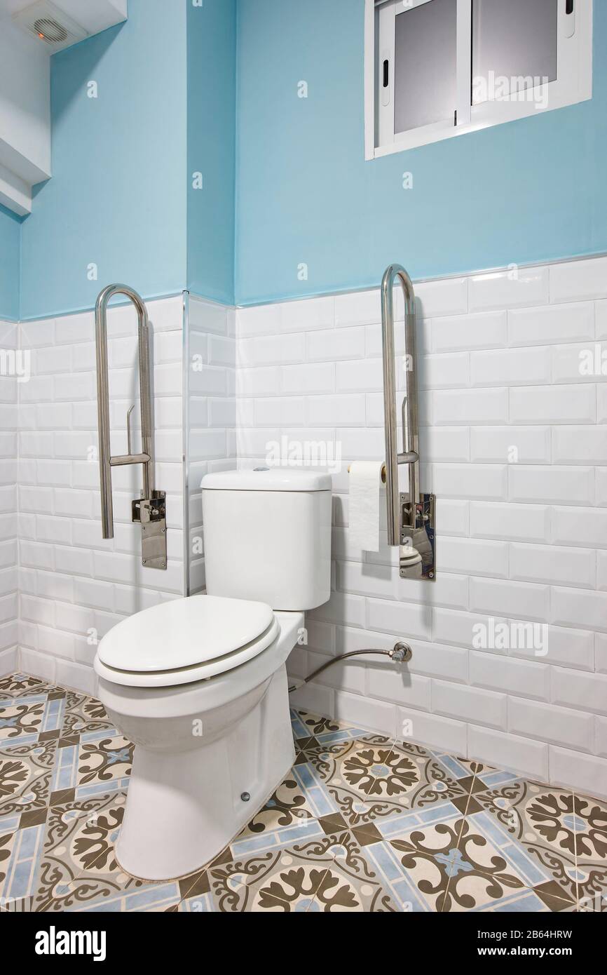 Adapted toilet for disabled people. Hotel room interior easy access ...