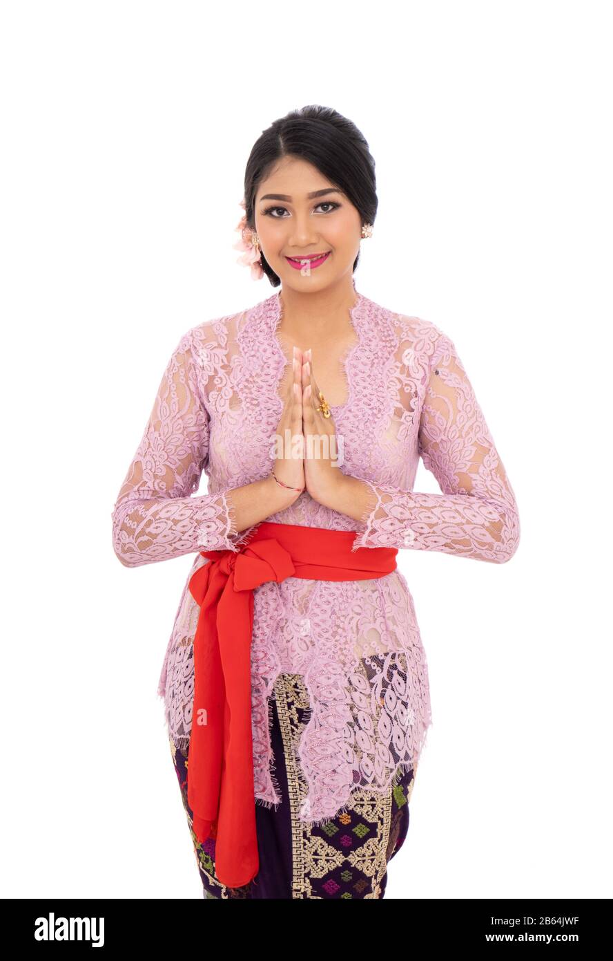 Balinese woman wearing traditional clothes with gestures welcoming ...
