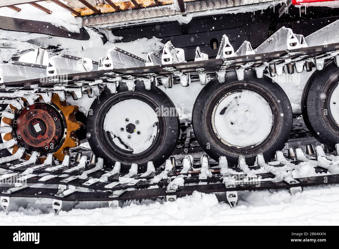 snowcat detail at winter snow storm, caterpillar and wheel detail Stock ...