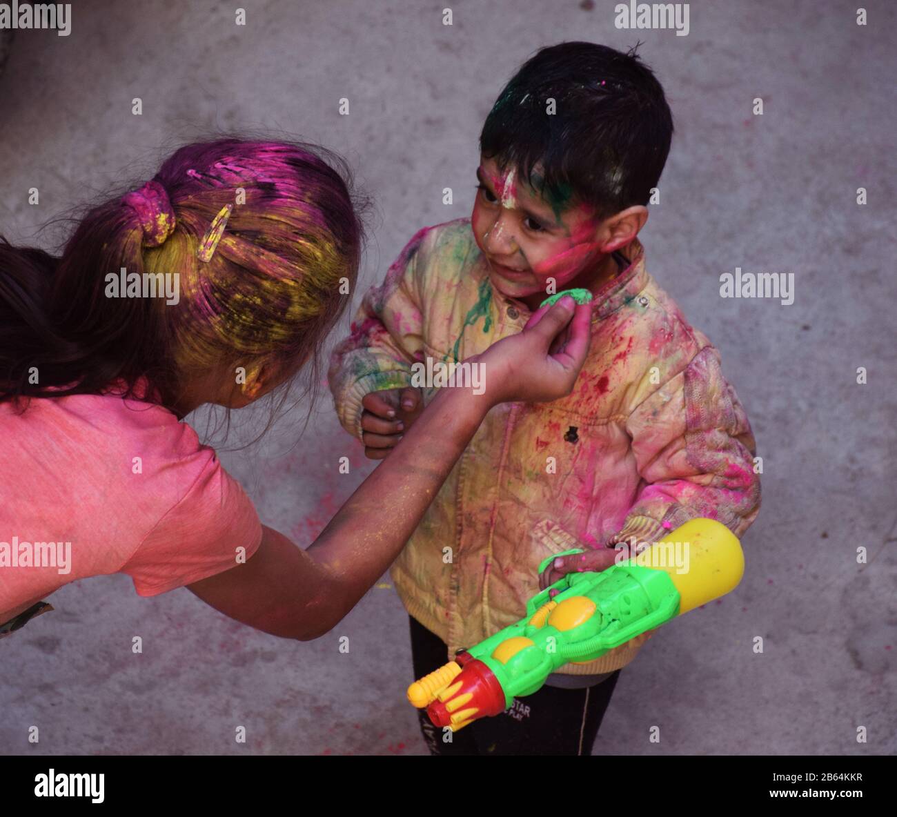 A kid playing Holi in India. Holi is also called as the festival of ...