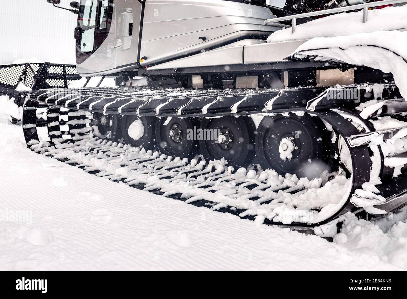 snowcat detail at winter snow storm, caterpillar and wheel detail Stock ...