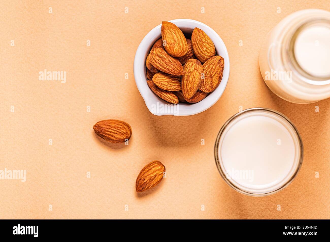 Almond milk and almonds, top view Stock Photo - Alamy