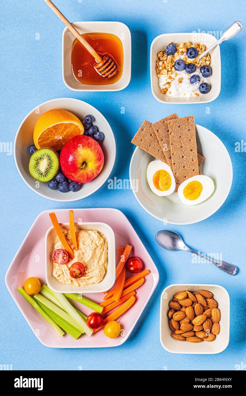 Healthy snack on a pastel background, top view Stock Photo - Alamy