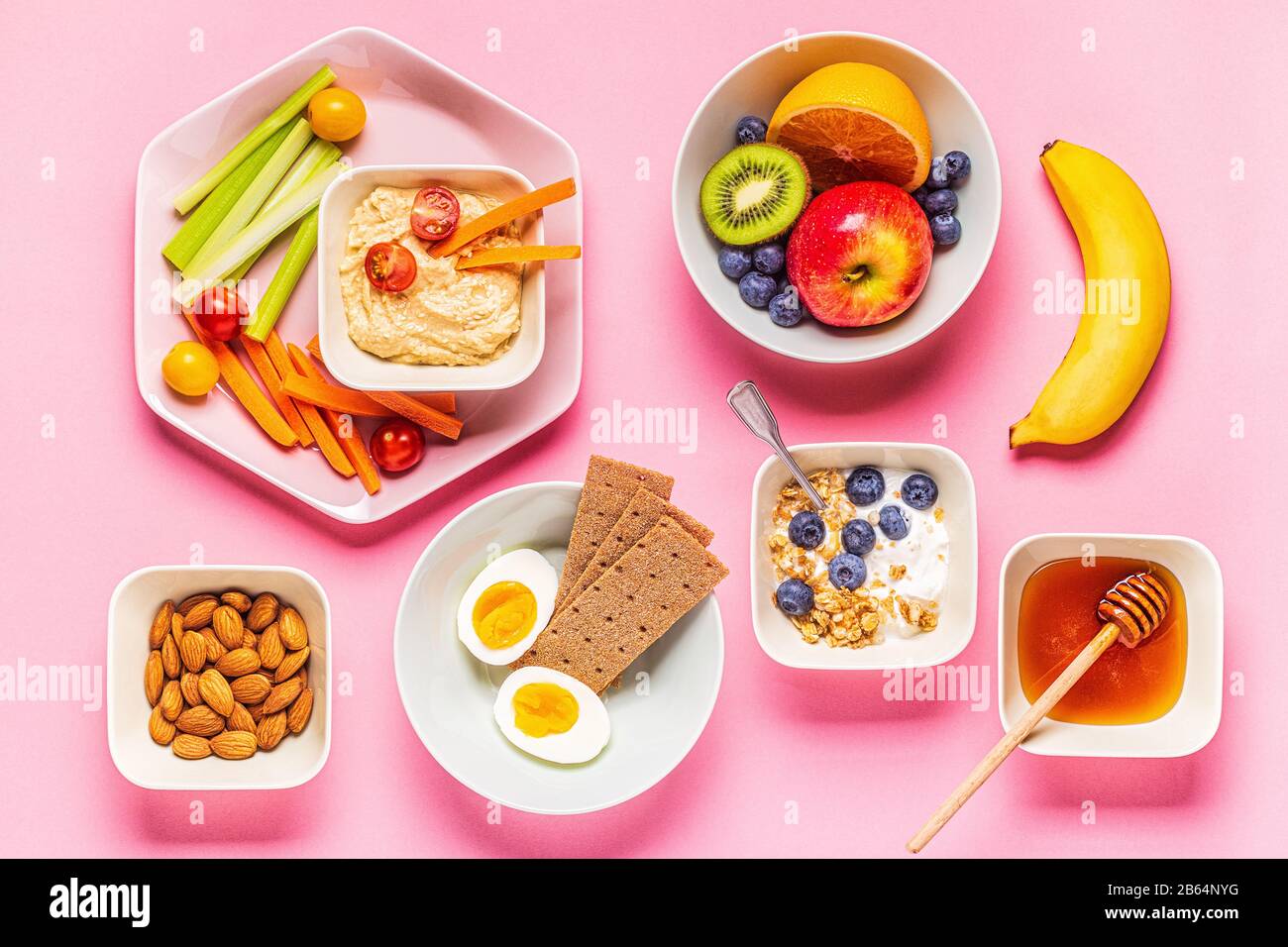 Healthy snack on a pastel background, top view Stock Photo - Alamy