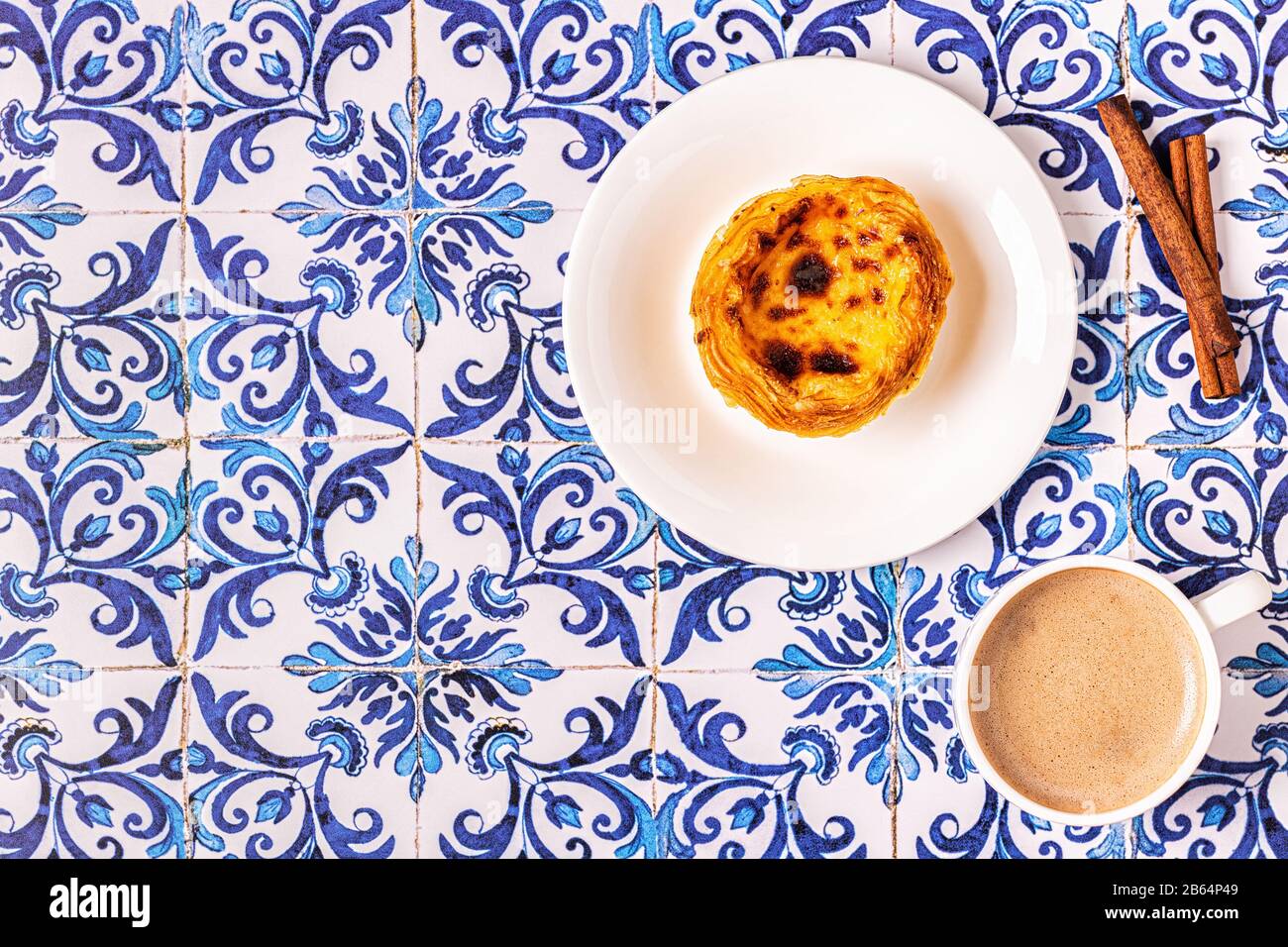 Egg tart, traditional Portuguese dessert, pastel de nata. Azulejo tile ...