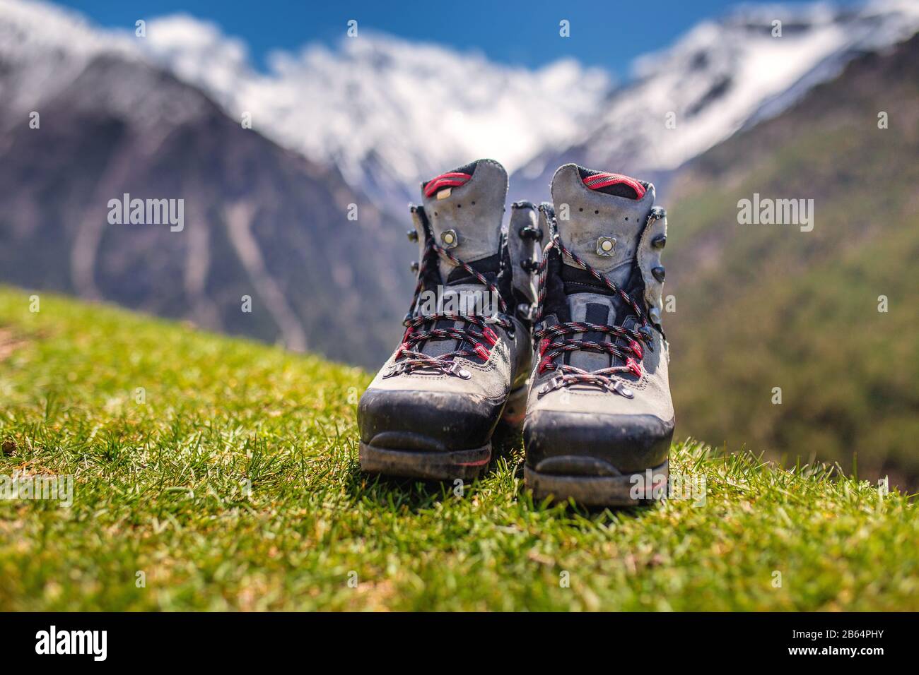 Old hiking shoes and Alpine landscape at background Stock Photo - Alamy