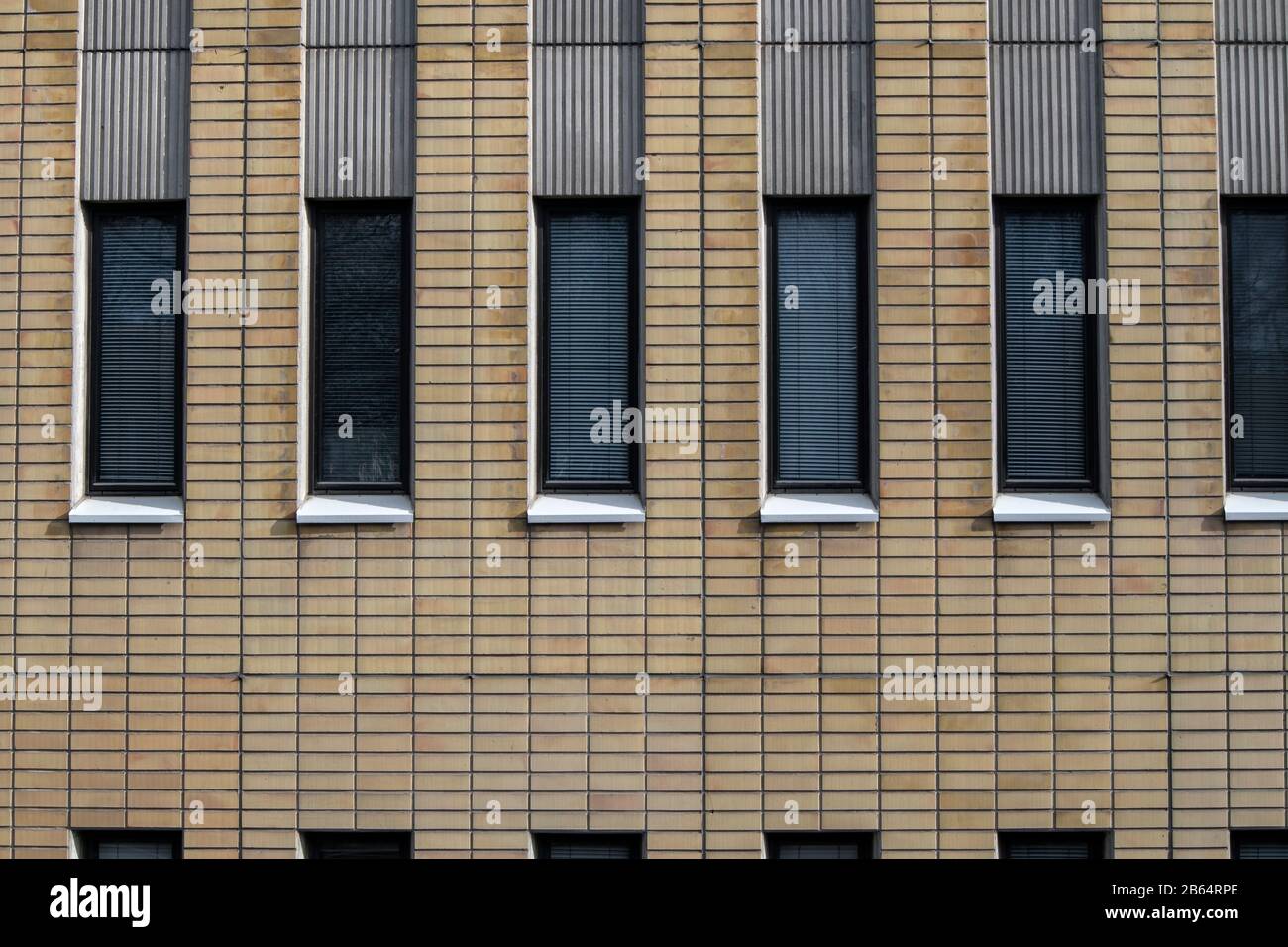 Facade of office building with narrow windows Stock Photo - Alamy
