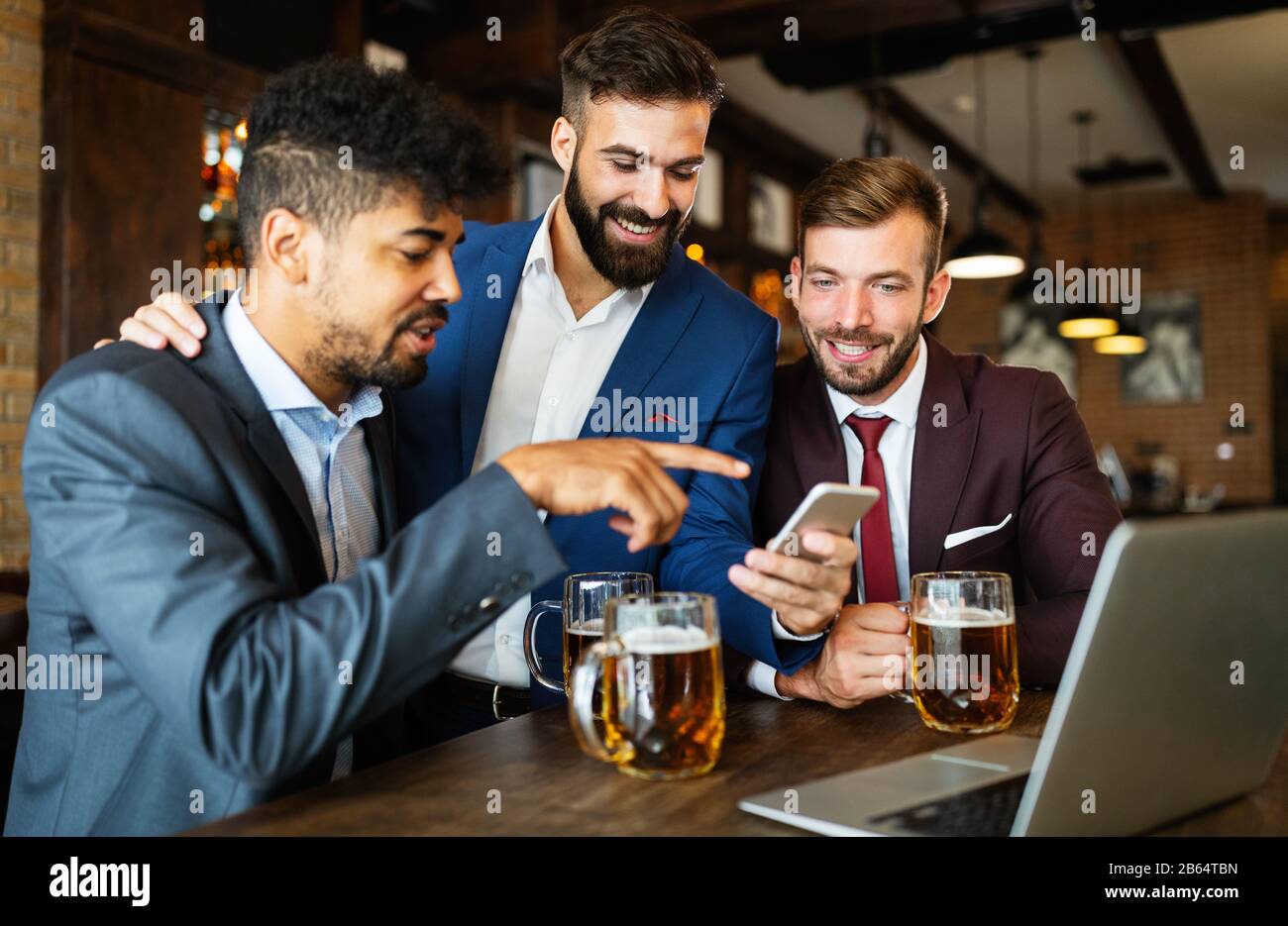Business people drink beer after work. Businessmen enjoy a beer Stock ...